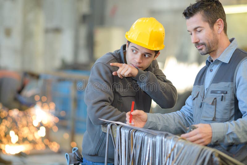 Supplier with Engineer Checking on Production in Factory Stock Photo ...