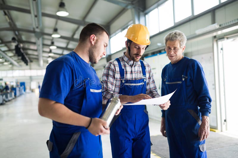 Supplier with Engineer Checking on Production in Factory Stock Photo ...