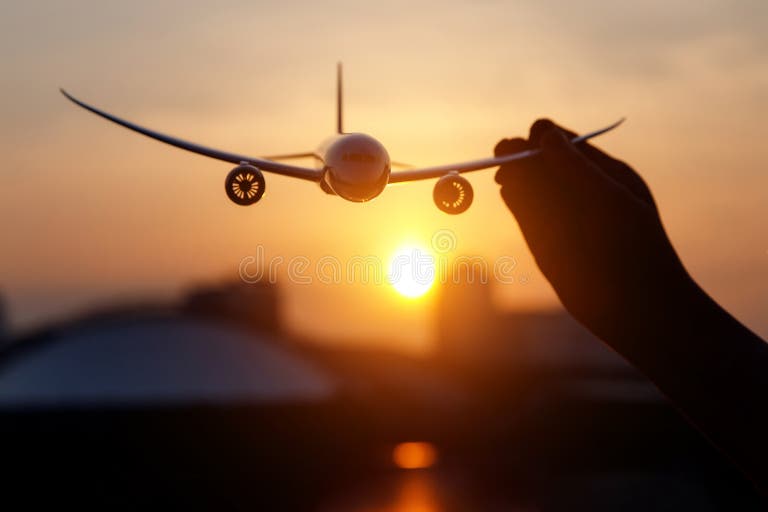 Support for the Airplane in the Sky. the Plane in the Hand of Assistant ...