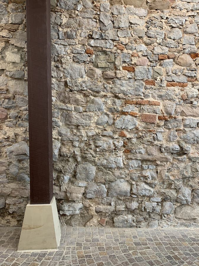 A Support Beam Near an Old Stone Wall Structure Stock Photo - Image of ...