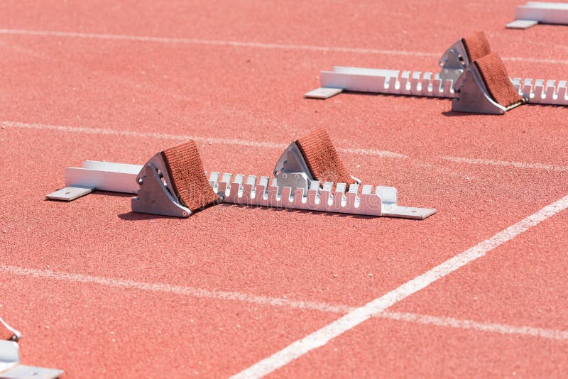 Runner in starting blocks stock image. Image of track - 13050567