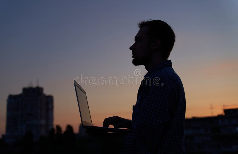 It Support Freelancer Male in Silhouette Using Laptop Outdoor at Sunset ...