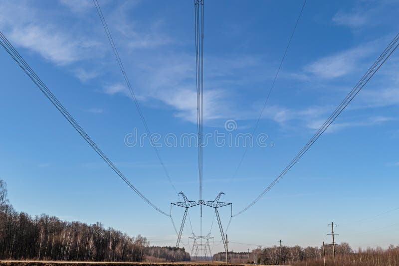 Support for a High-voltage Power Line Against the Blue Sky and Sunlight ...