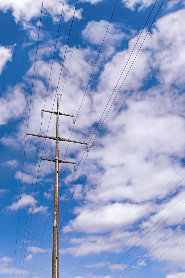 Support for a High-voltage Power Line Against the Blue Sky and Sunlight ...