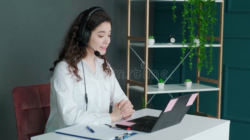 Support Hotline Worker with Laptop and Microphone at Work. Stock Video ...