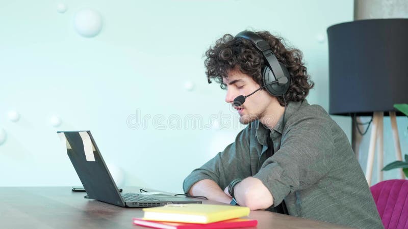 Support Hotline Worker with Laptop and Microphone at Work. Stock ...