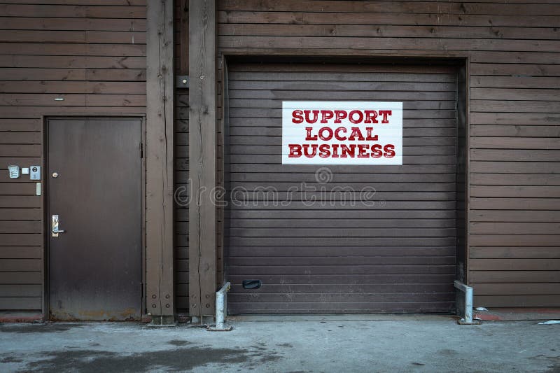 Support Local Business. a Large Sign on the Warehouse Door Stock Image ...