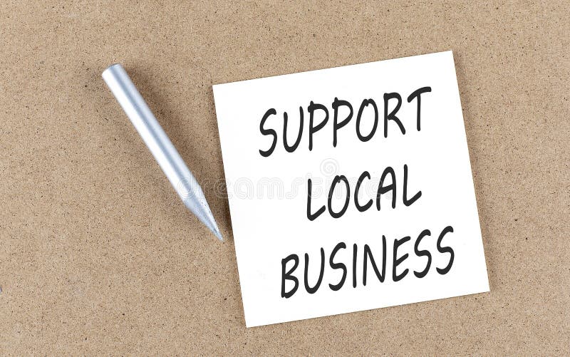 SUPPORT LOCAL BUSINESS Text on Sticky Note on Cork Board with Pencil ...