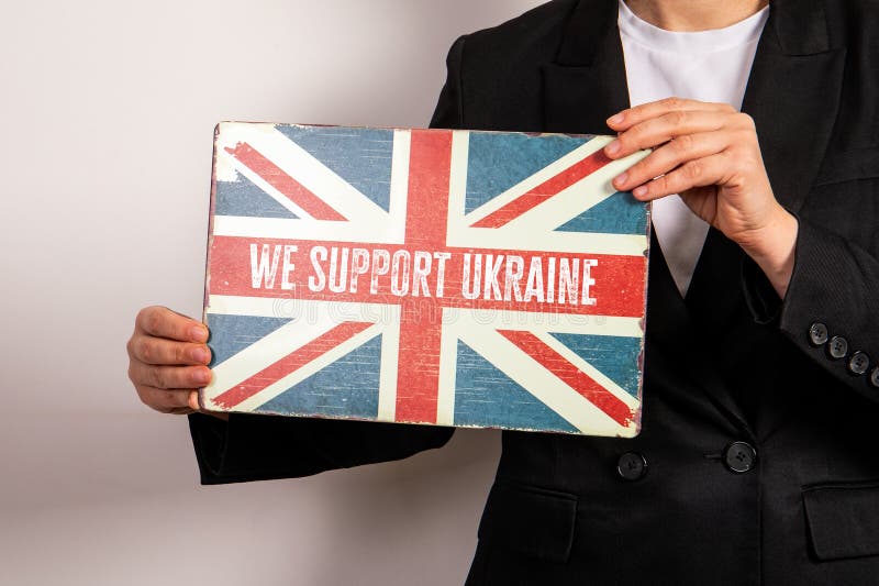 We Support Ukraine. British Flag in a Woman& X27;s Hands Stock Photo ...
