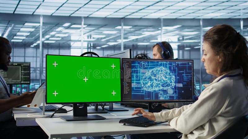 It Support Workers In Ai Data Center Coding On Green Screen Computers