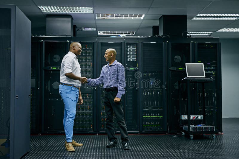 It Support You Can Trust. Two Men Shaking Hands in a Data Center. Stock ...