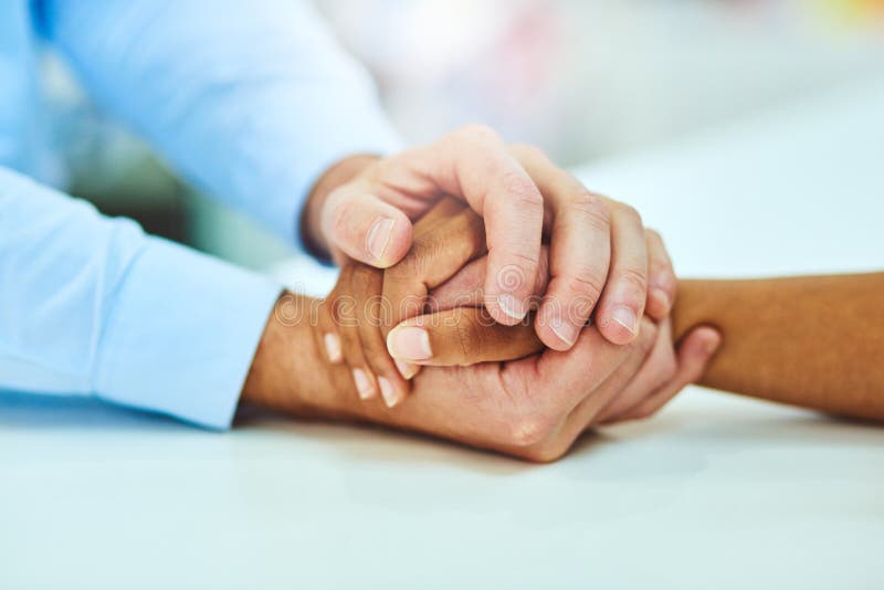 Support Your Loved Ones. Two Unrecognizable People Holding Hands in ... Support Your Loved Ones. Two Unrecognizable People Holding Hands in ...
