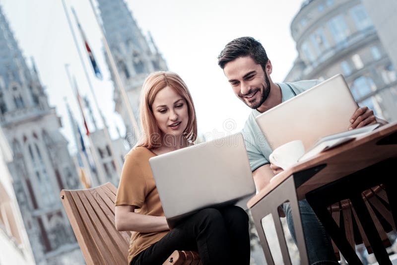 Friendly Colleagues Discussing Project Outdoors Stock Image - Image of ...