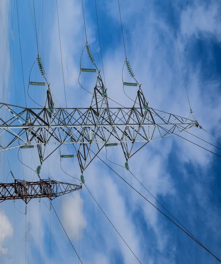 Supports High-voltage Power Against the Blue Sky with Clouds ...