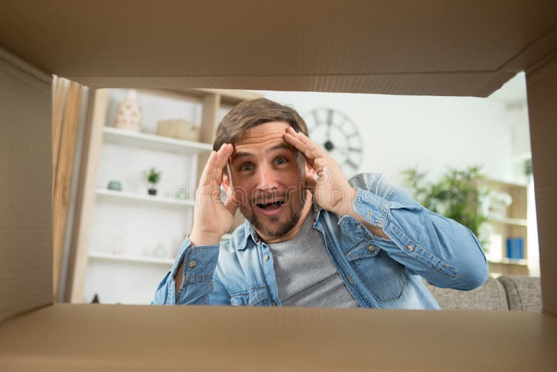 Suprised Man Looking for Something Inside Box Stock Image - Image of ...