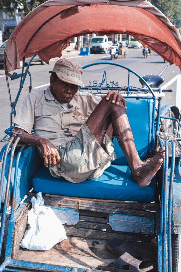 Surabaya, East Java, Indonesia - April 18, 2021 -Â Old Pedicab Driver ...