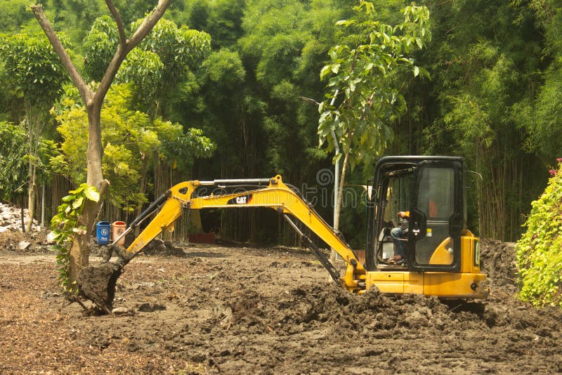 A Worker on Modern Excavator Performs Excavation Work on the ...