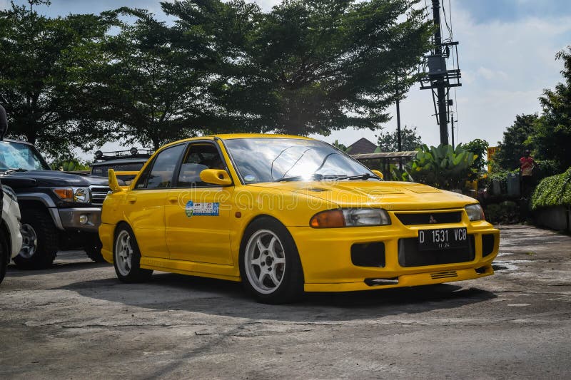 Yellow Mitsubishi Lancer Evolution III Leaving JDM Run Car Meet ...