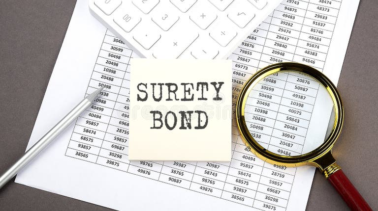 SURETY BOND Text on Sticker on the Chart ,with Calculator and Magnifier ...