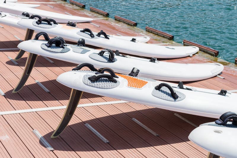 Surf Boards Stacked To Dry on the Dock Stock Photo - Image of harbor ...