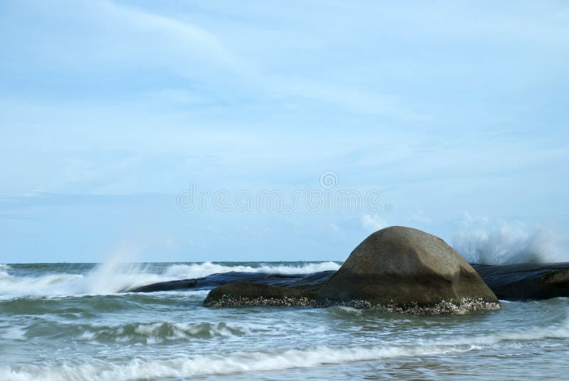 Surf breaking against rock stock image. Image of liquid - 25503511