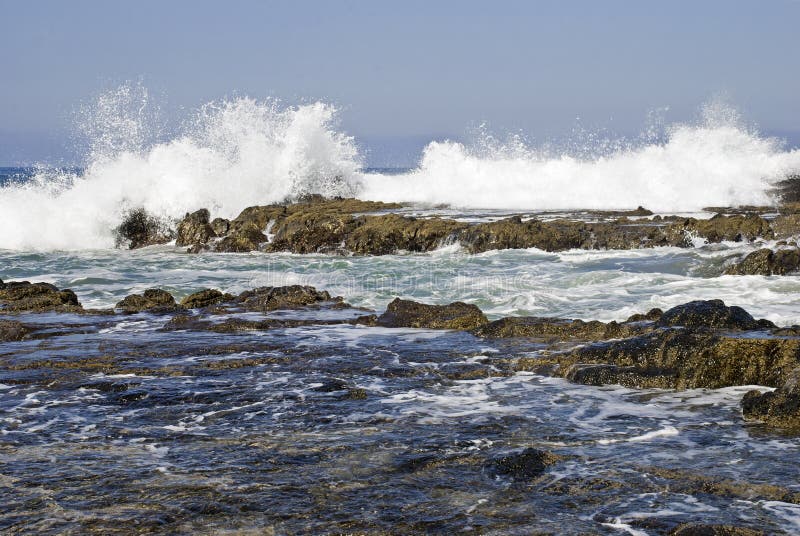 Surf Breaking on Rocky Ocean Shore Stock Image - Image of surf ...