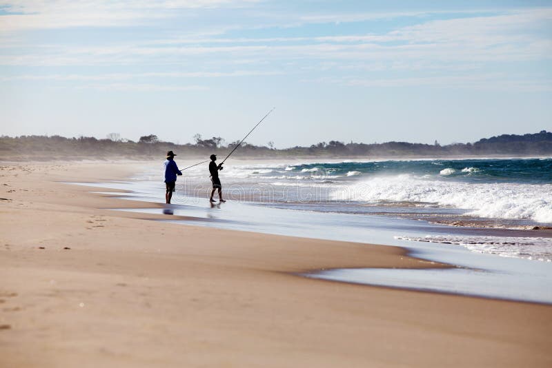 Surf Cast Fishing on an Ocean Beach Stock Photo - Image of waves, wave ...