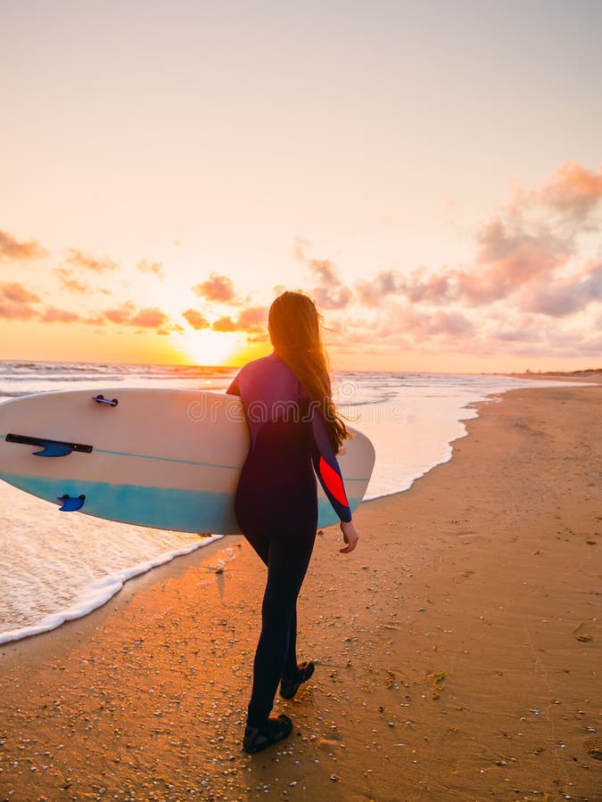 Surf Girl with Long Hair Go To Surfing. Woman with Surfboard on a Beach ...