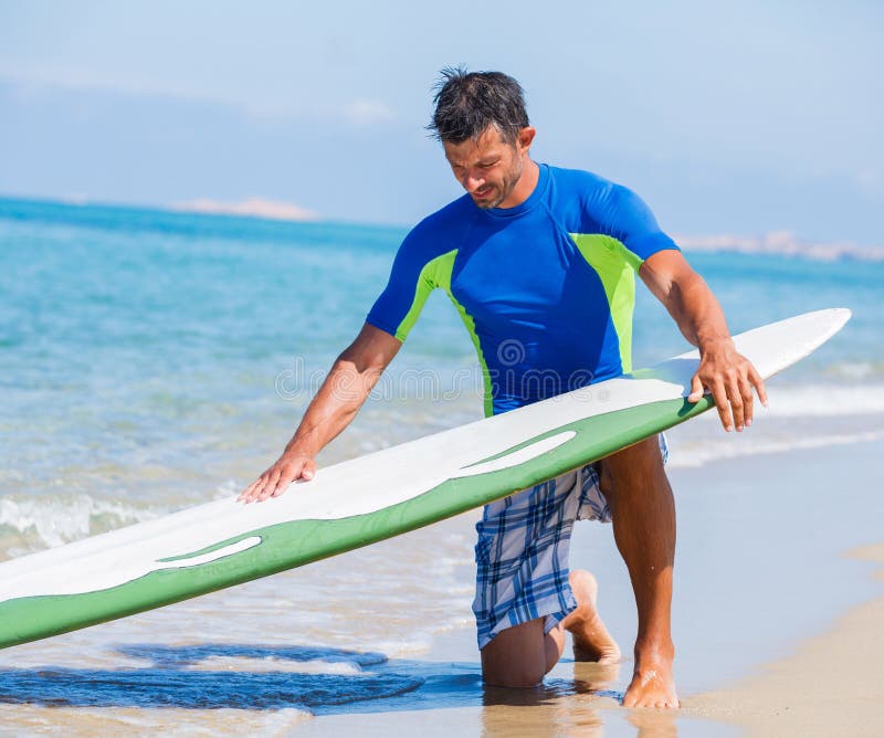 Surf man stock image. Image of handsome, looking, coast - 52045391