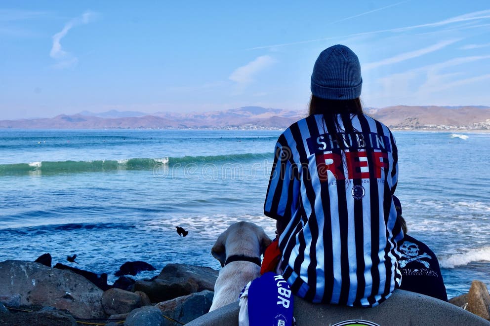 Surf Ref. Sitting on a Large Boulder with Her White Lab Dog and Her ...