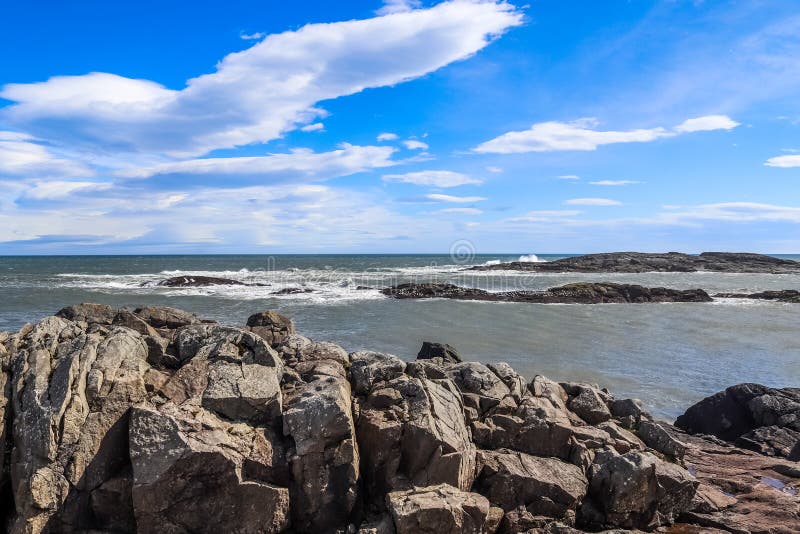 A Surf on a Rocky Beach with Black Sand in Iceland Stock Photo - Image ...