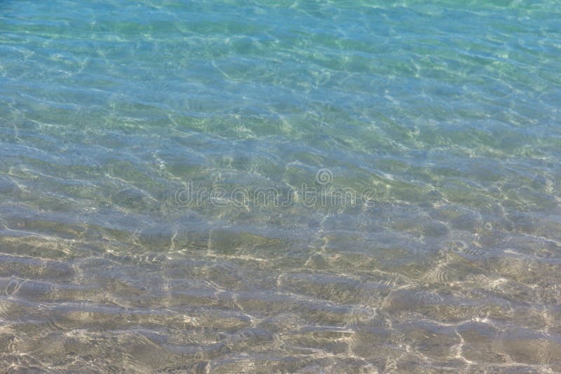 Surface of Blue Ocean or Clear Water Reflections on Sandy Beach Bottom ...