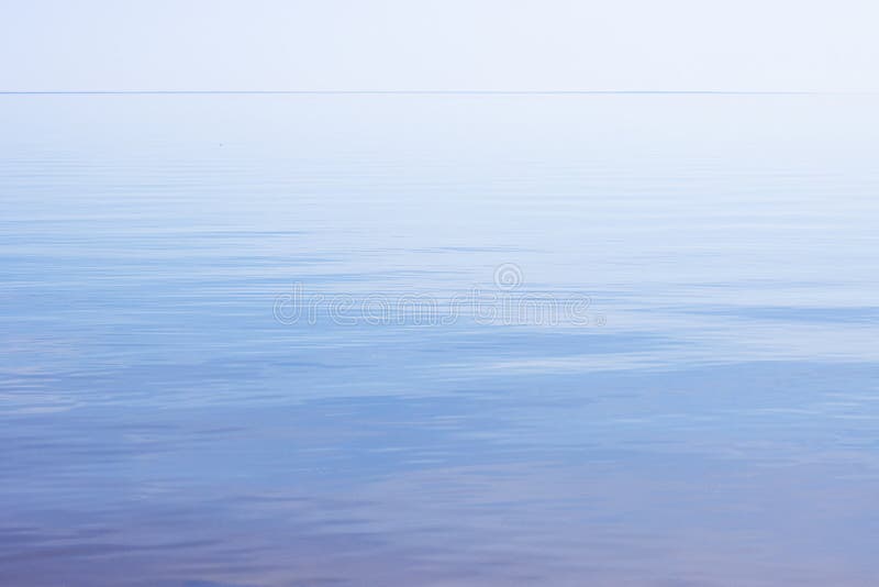 The Surface of a Blue Sea, a River without Waves Under a Clear Blue Sky ...