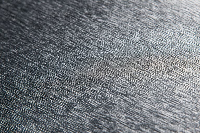 Surface of Brushed Metal Reflecting Light in a Subtle Pattern during ...