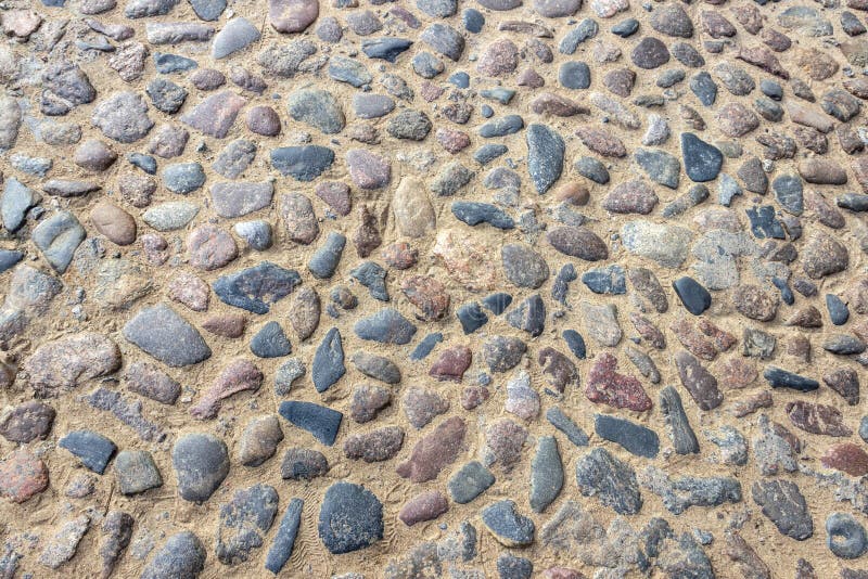 The Surface of the Cobblestone Pavement, Lined with Round Stones Stock ...