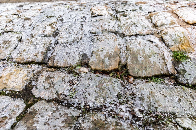 The Surface of the Cobblestones is Covered with Ice Stock Photo - Image ...