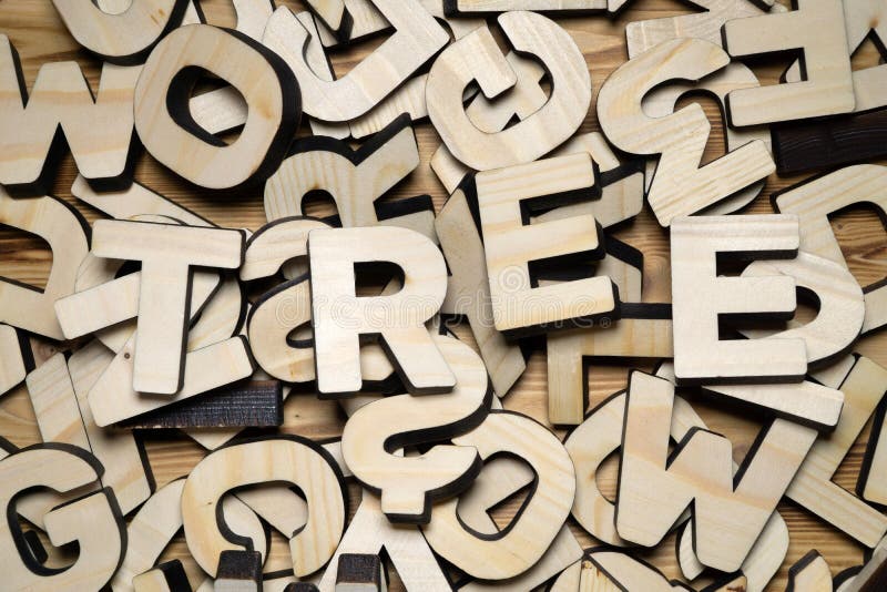 Surface Covered with Random Wooden Letters and Word TREE on Top. Stock ...