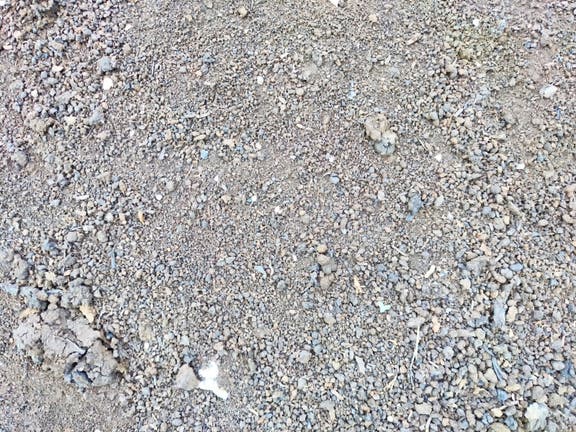 The Surface Features a Rugged Texture of Earth and Stones, Providing an ...