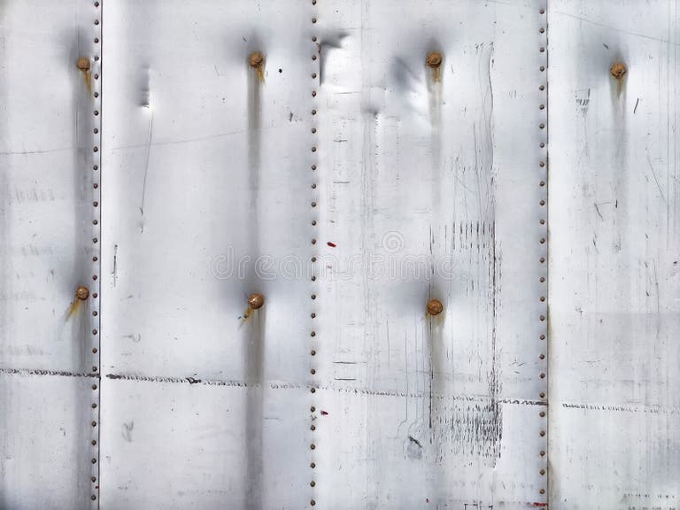 The Surface Features a Textured Metallic Pattern with Visible Rivets ...