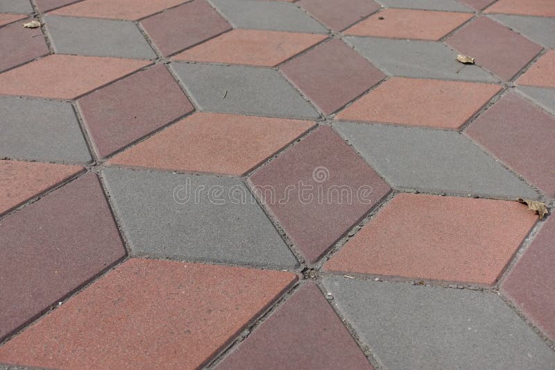 Geometric Pavement Made of Grey, Coral and Maroon Concrete Tiles Stock ...