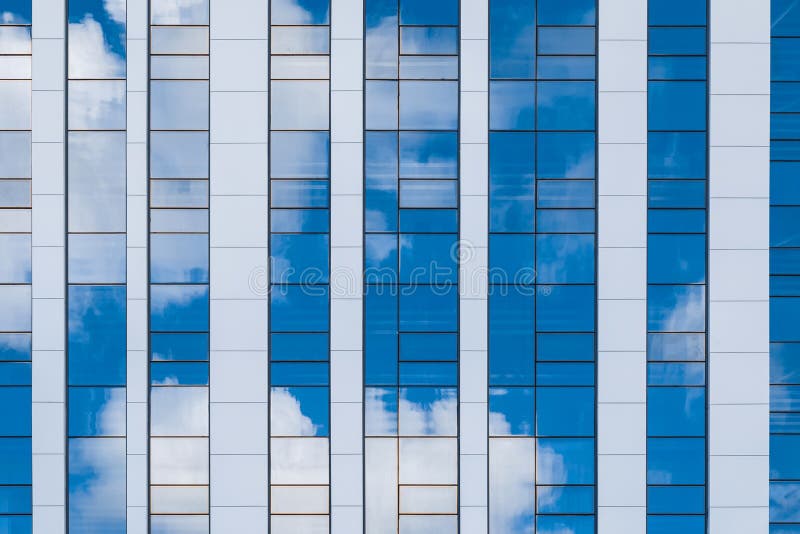 The Surface of a Glass High-rise Building with Reflection of Clouds ...