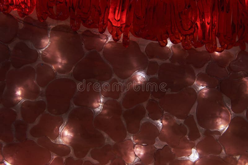 The Surface is Made of Embossed Red and Brown Glass, Which is ...