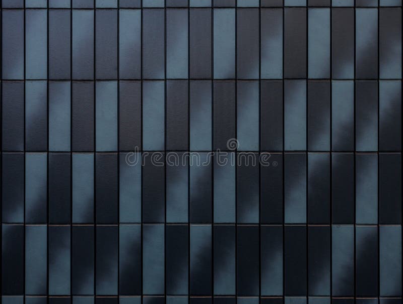 The Surface is Made of Rectangular Ceramic Tiles in Black and Blue with ...