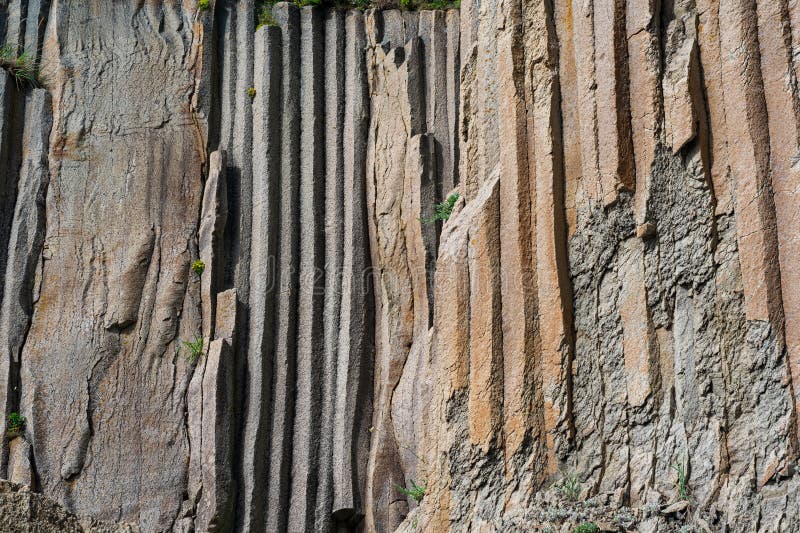 Surface of a Rock Wall Formed by Columnar Basalt Stock Photo - Image of ...