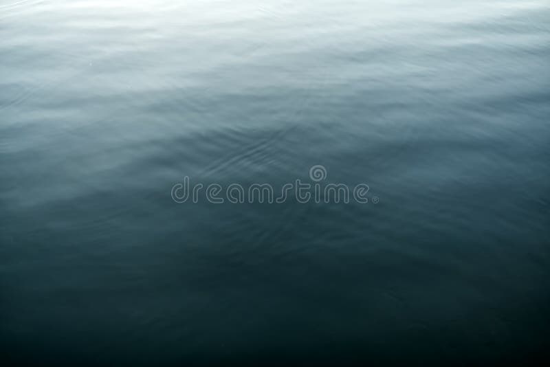 The Surface of the Water with a Gradient of Color from Dark To Light ...