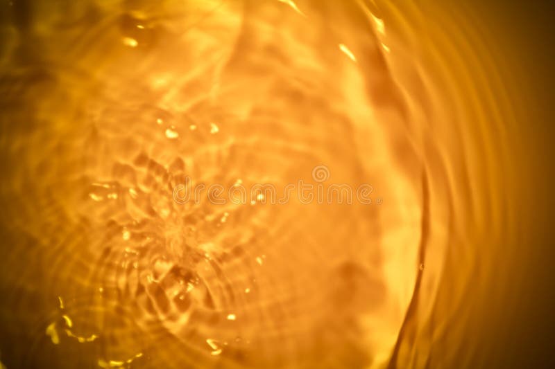 The Surface of the Water Ripples Orange and Creates Water Ripples Stock ...