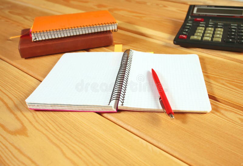 Surface of a Wooden Table with Notebook, Smartphone, Eye Glasses, and ...