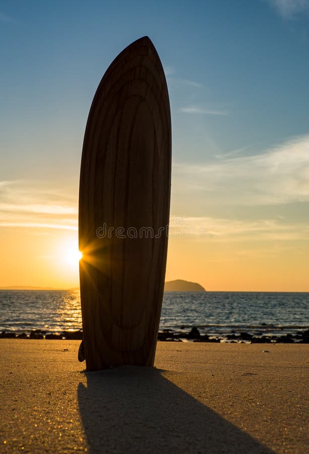 Surfboard on the Beach at Sunset Stock Photo - Image of sunrise, action ...