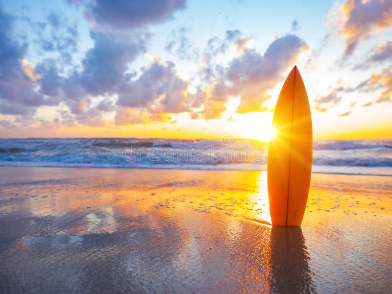 Surfboard on the Beach at Sunset Stock Photo - Image of sunrise, surf ...