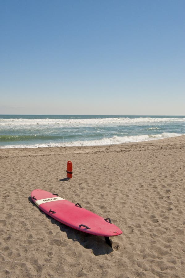 Surfboard and Float on Beach Stock Photo - Image of surfing, lifeguard ...